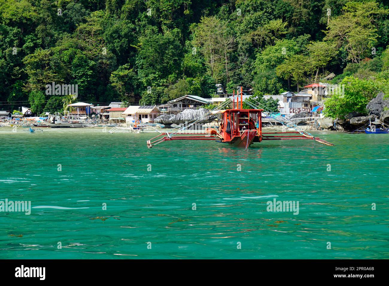 wooden traditional outrigger boats on palawan island at the philippines ...