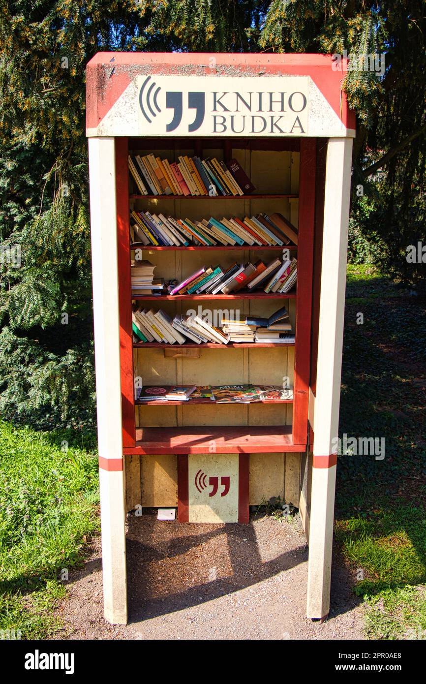 A phone booth in a park used as a public mini library. Czech Republic ...