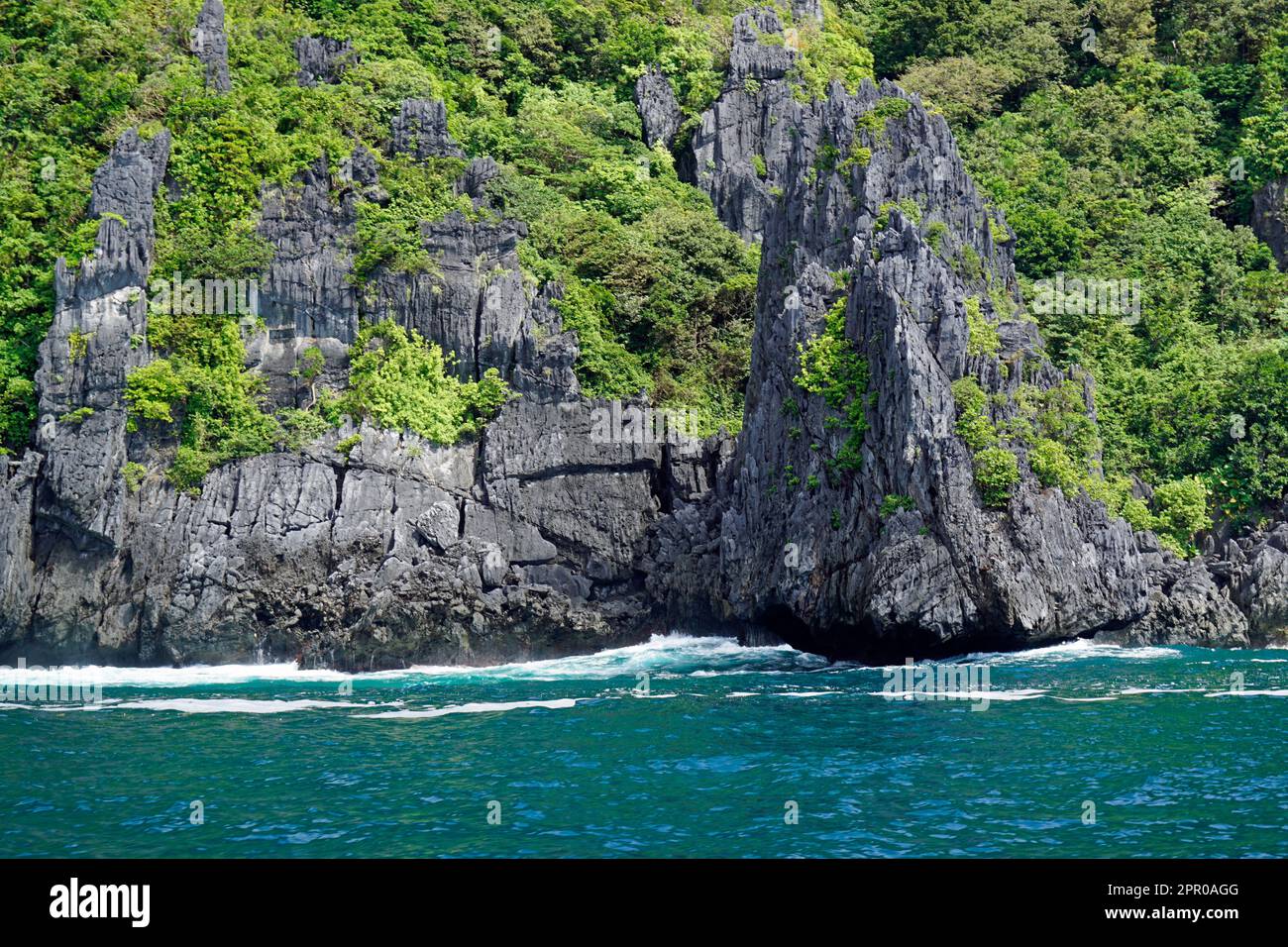 massive limestone rocks in the blue sea at the el nido archipelago ...