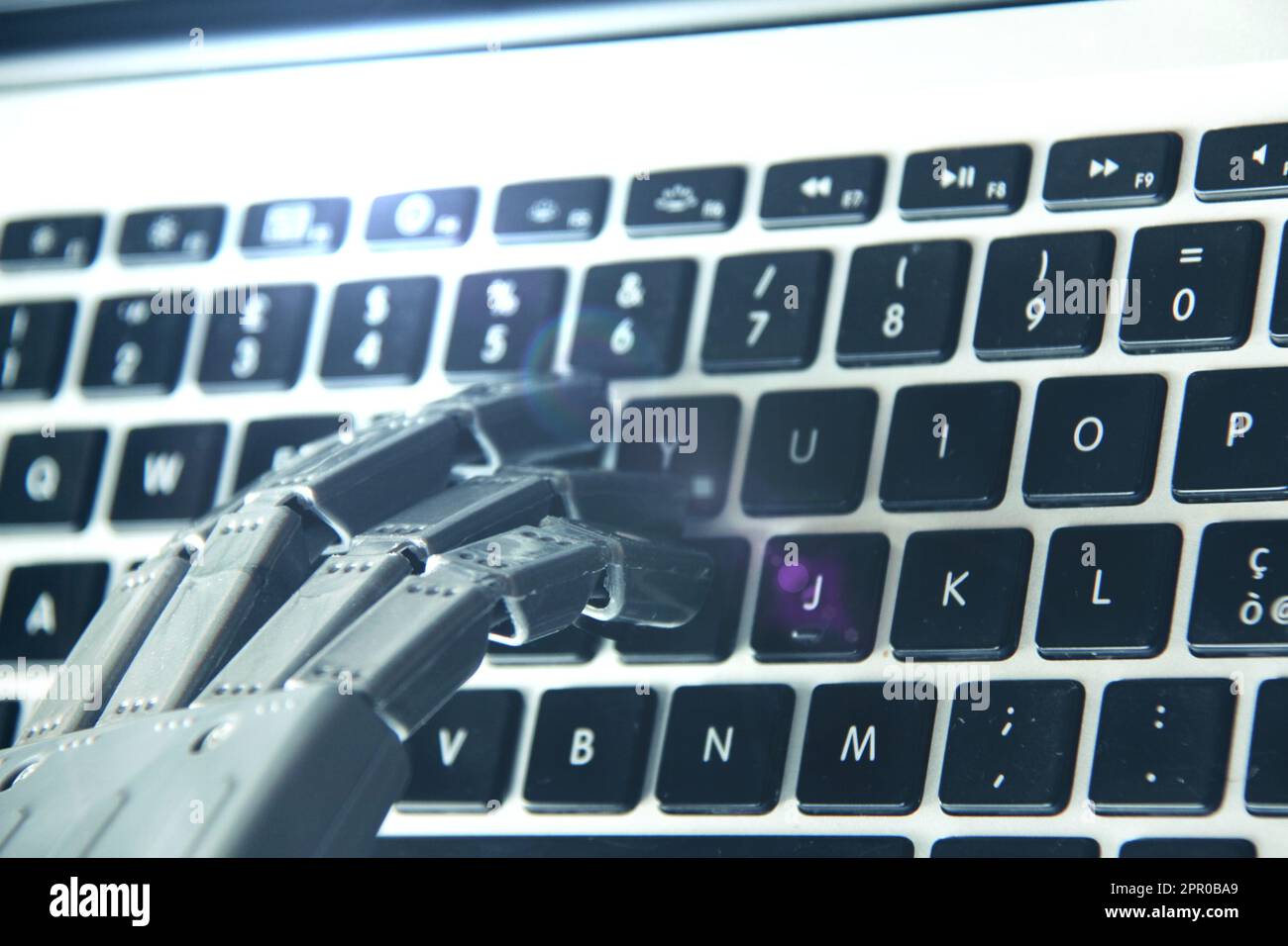 Shoot of a Robot hand while operating on a computer keyboard Stock ...