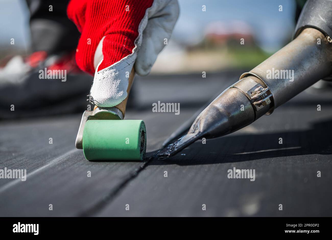 Roof Worker Attaching Pieces of EPDM Membrane Roofing Material Using ...