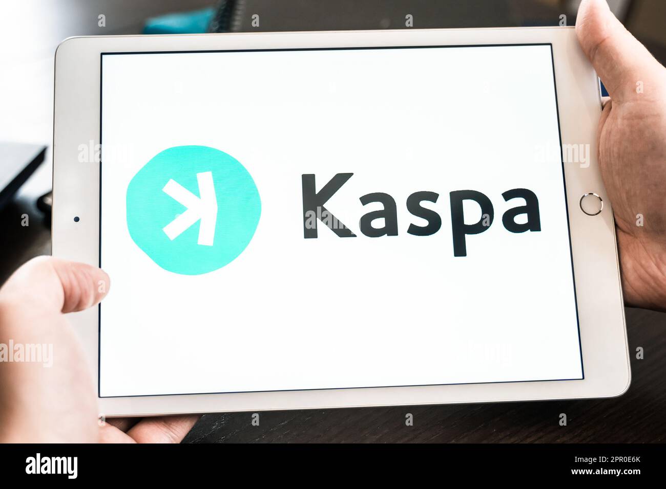 Russia Moscow 25.04.23 Logo of Kaspa mining coin in tablen screen. Cryptocurrency KAS token ...