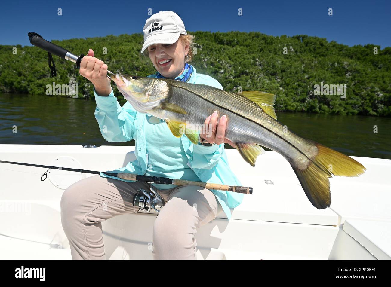 An angler admires a nice catch from the flats and islands off Crystal ...