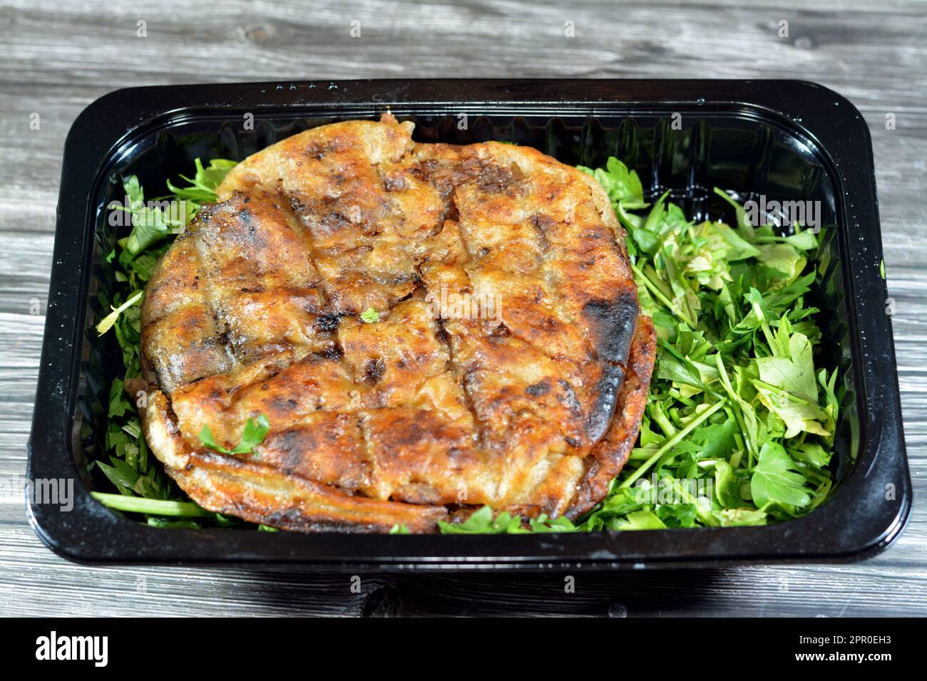 Traditional Egyptian dish Hawawshi, pita stuffed with minced meat and ...