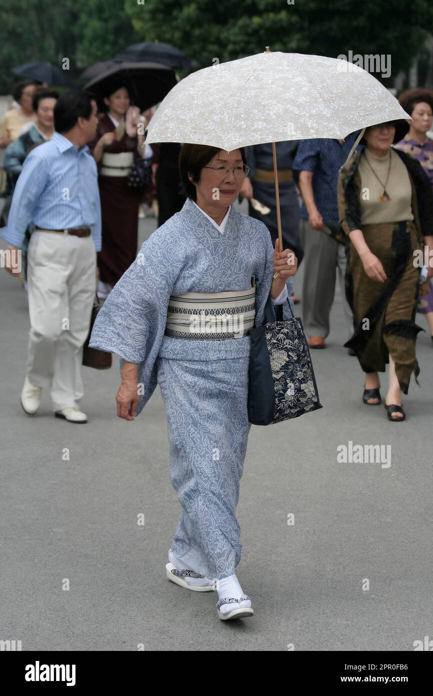 TOKYO, JAPAN-JULY 21:Unidentified Old Japanese Woman in Kimono walking ...