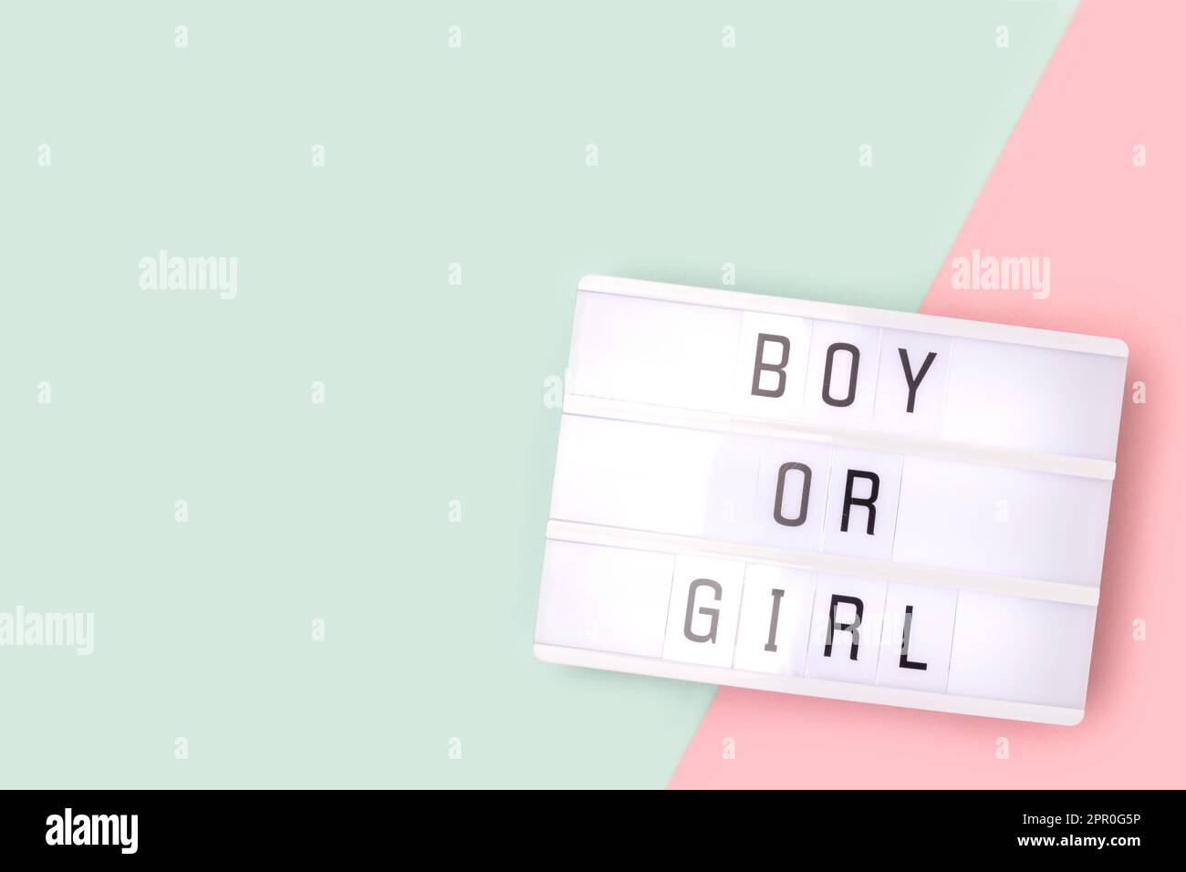 Boy or girl. Lightbox with letters on a pink and blue background. Baby ...