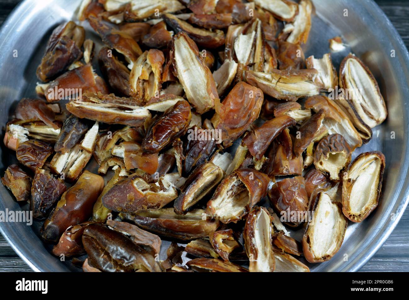 A tray with cracked dried dates fruit, Ramadan dried fruits Yameesh of ...