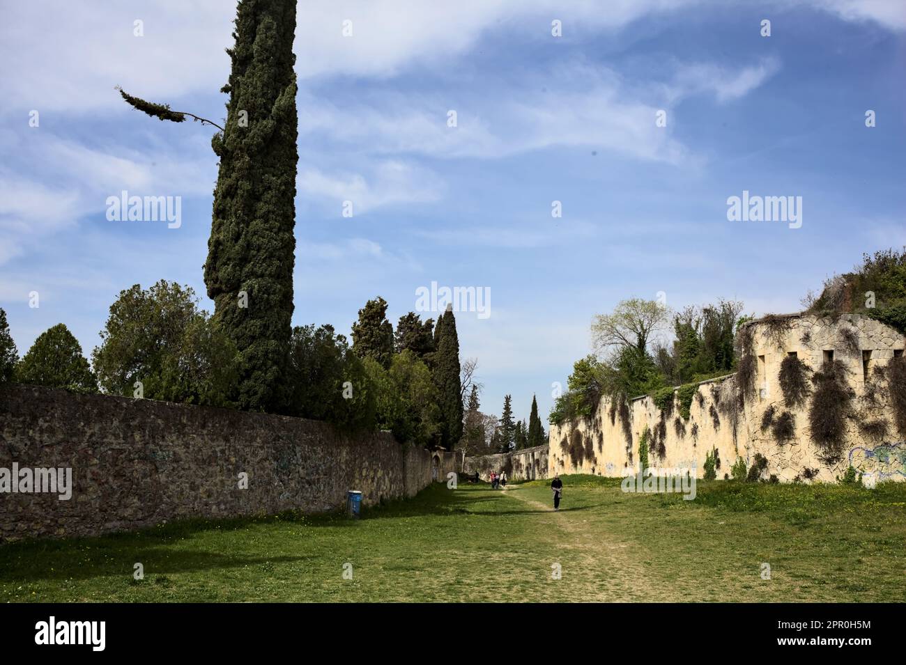 Large passage between boundary walls in a park by the hillside Stock ...