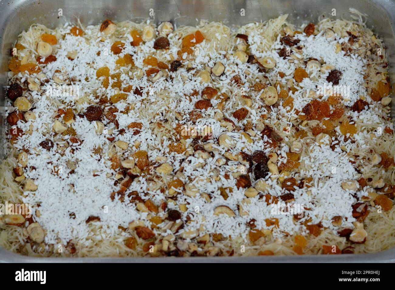 A traditional middle eastern dessert Knafeh made with spun pastry ...