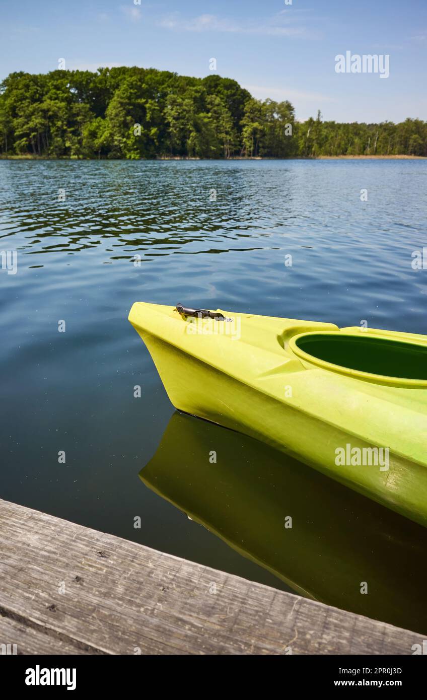 Pier with canoe at lake hi-res stock photography and images - Alamy