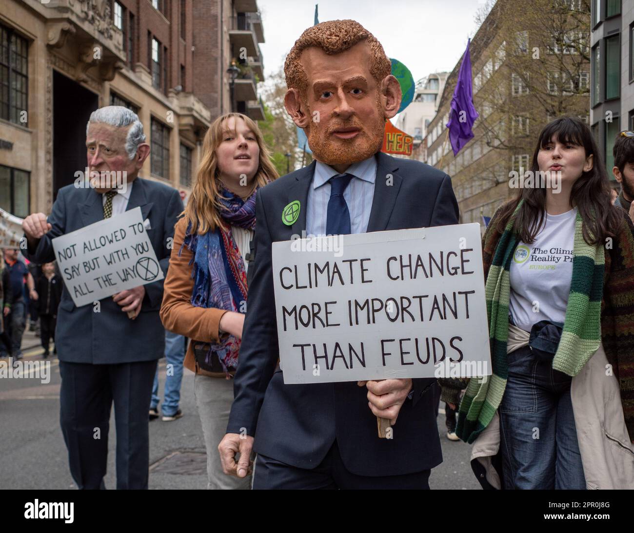 Climate change activist wearing a Prince Harry mask marches to ...