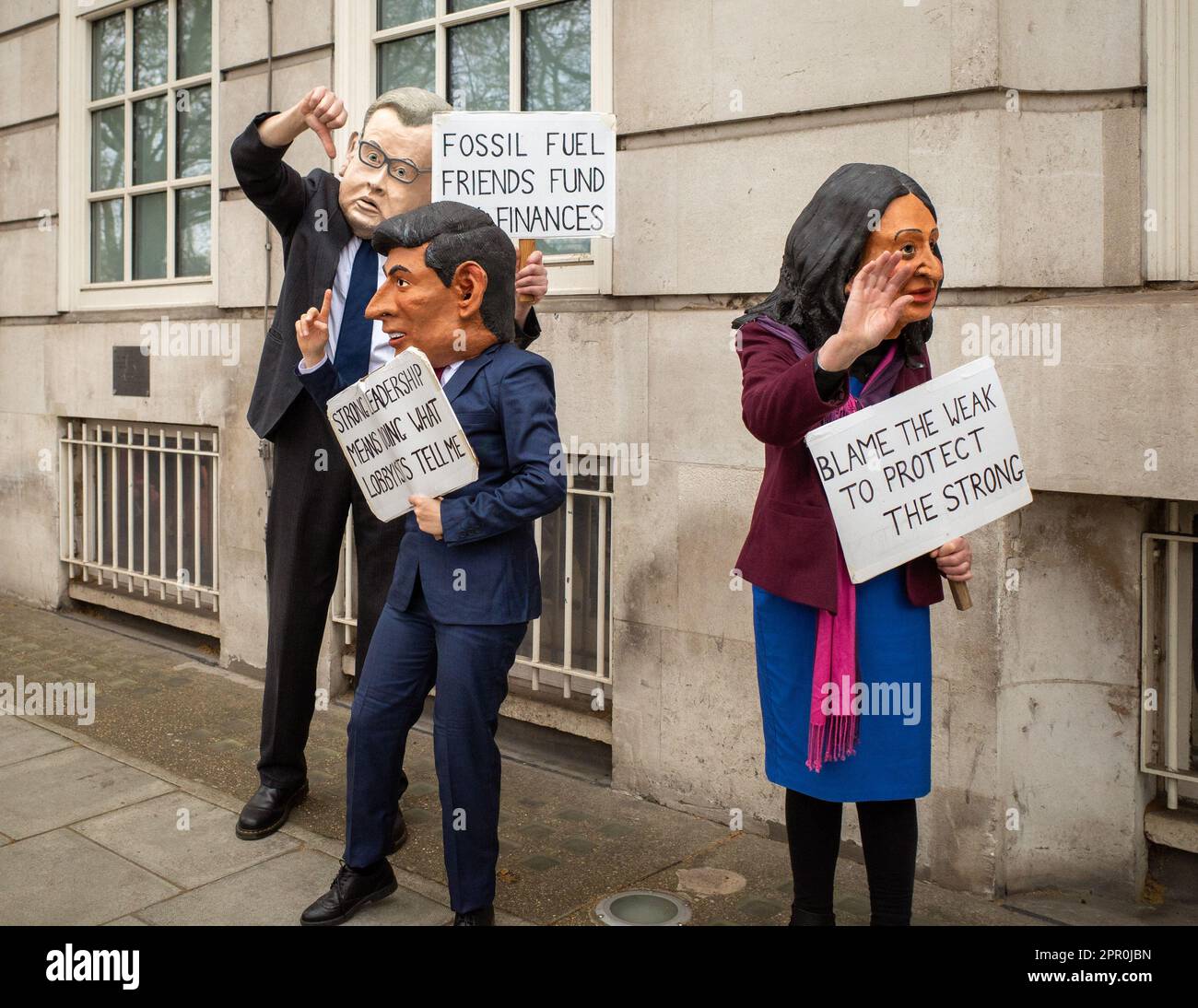 People wearing Rishi Sunak and Suella Braverman masks at the Extinction ...