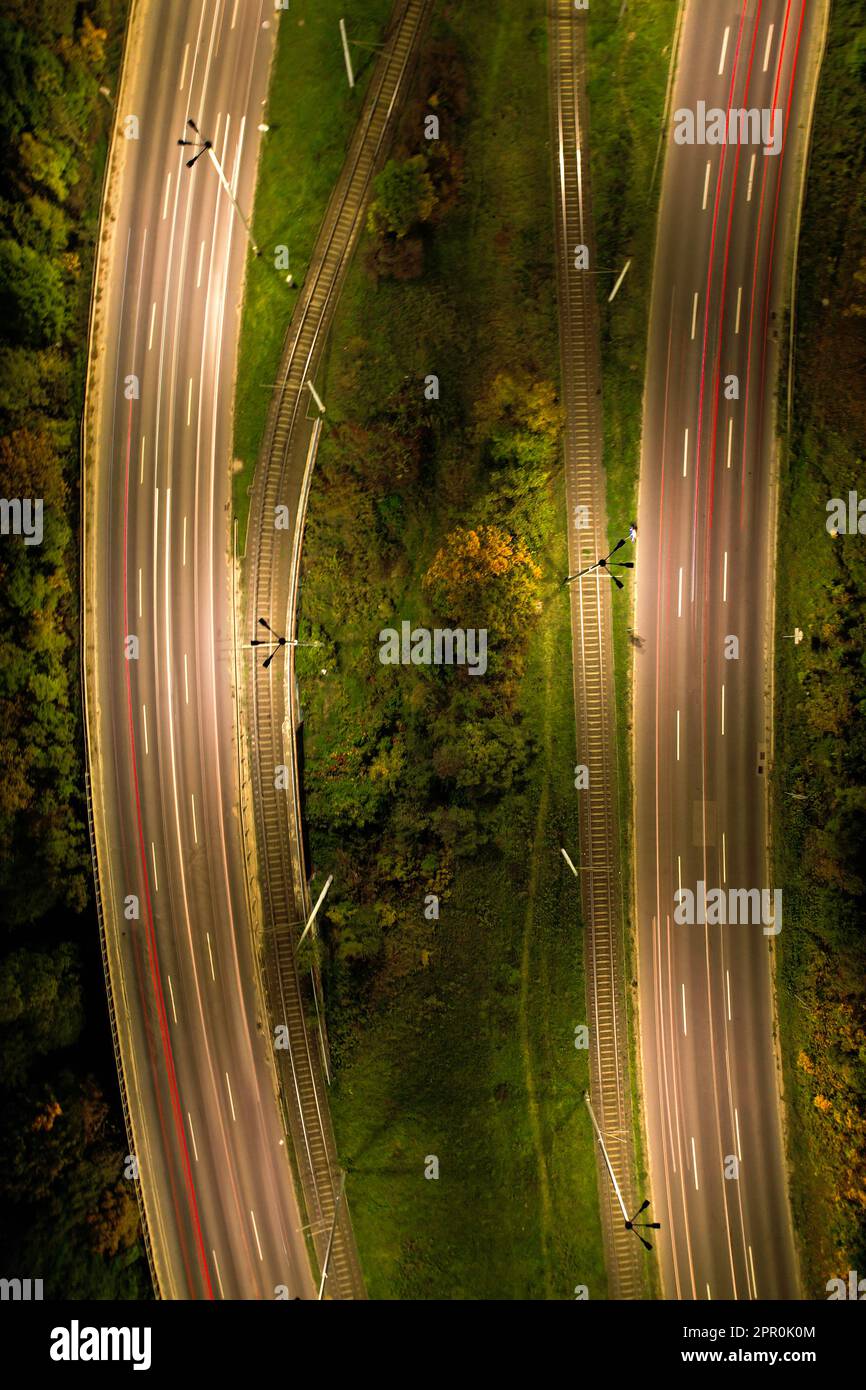 Top down view to road. Romantic night aerial photo of cars traveling ...