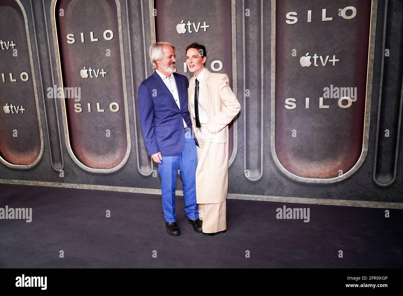 Screenwriter Graham Yost, left, and actor Rebecca Ferguson arrive to ...