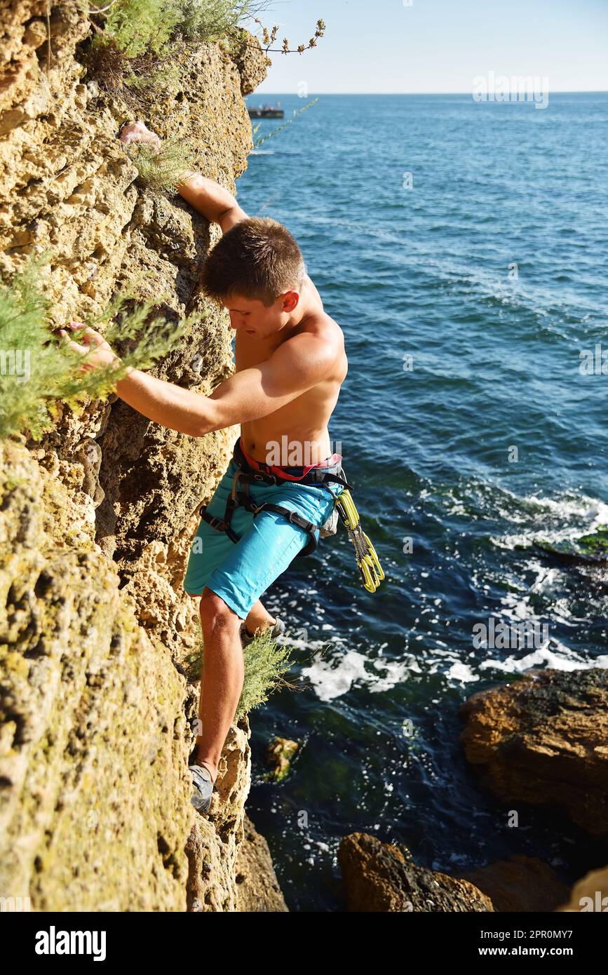 Man climbs on top wall hi-res stock photography and images - Alamy