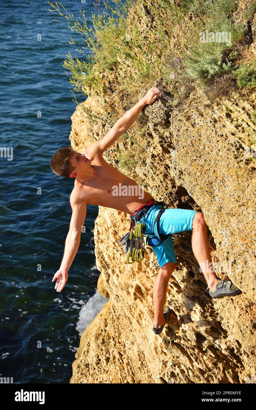 extreme climber man caught on a rock, view from above Stock Photo - Alamy