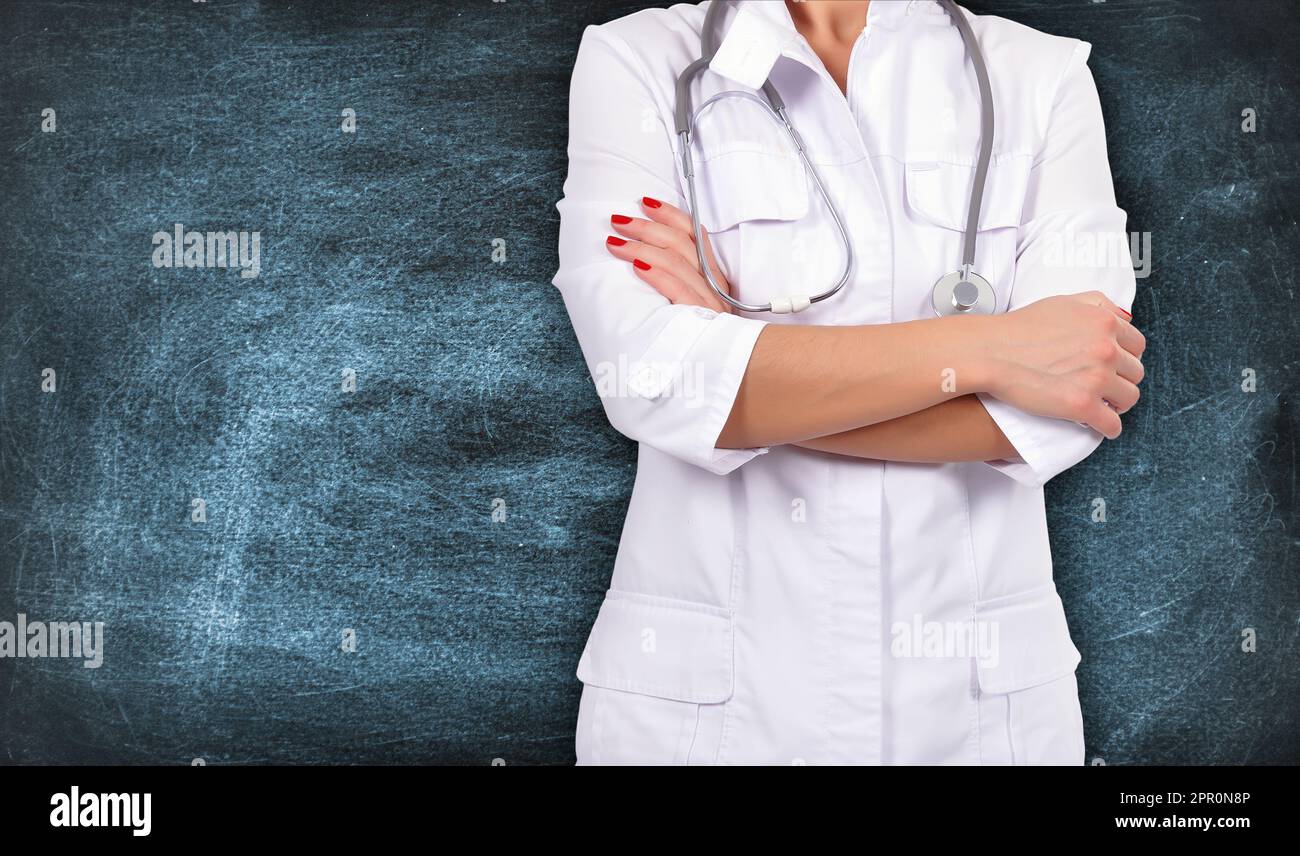 woman doctor with stethoscope standing neer blank blackboard Stock ...