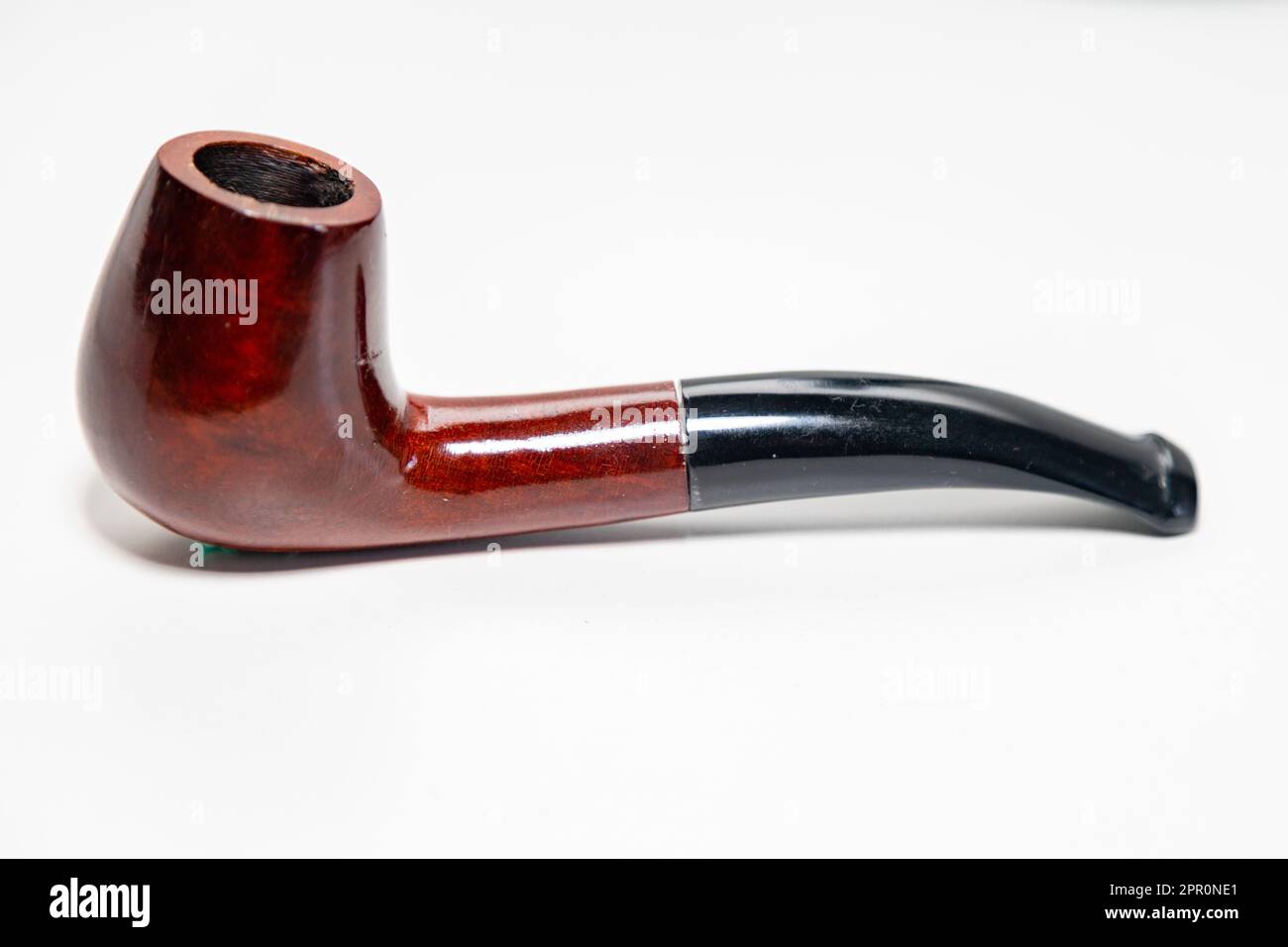 Traditional pipe isolated on light background Stock Photo - Alamy