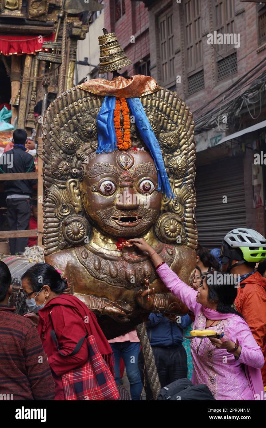 Lalitpur, Nepal. 25th Apr, 2023. A devotee makes offerings during the ...