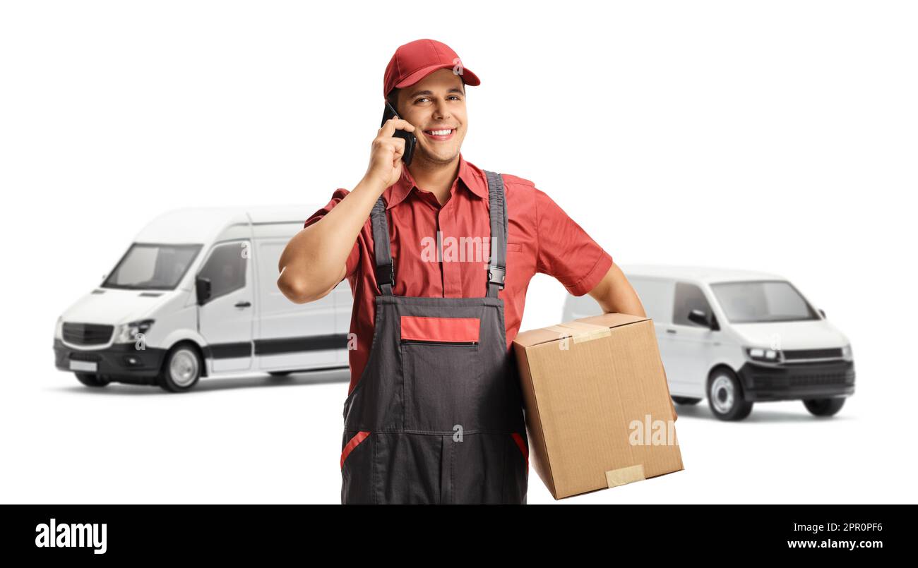 Male worker with a delivery box using a mobile phone and standing in ...