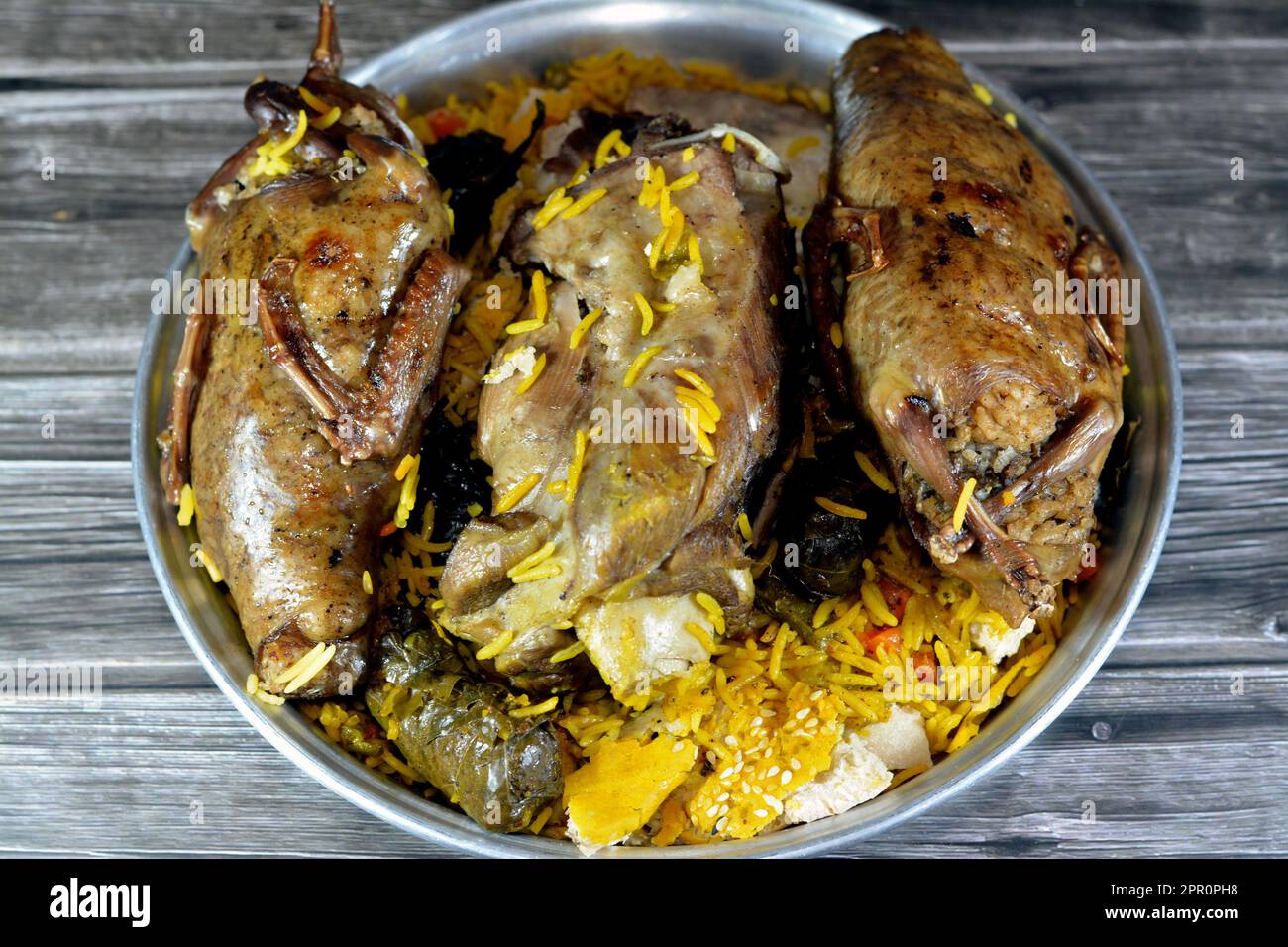 Egyptian Hamam pigeons Mahshi stuffed squab with rice and a lamb shank ...