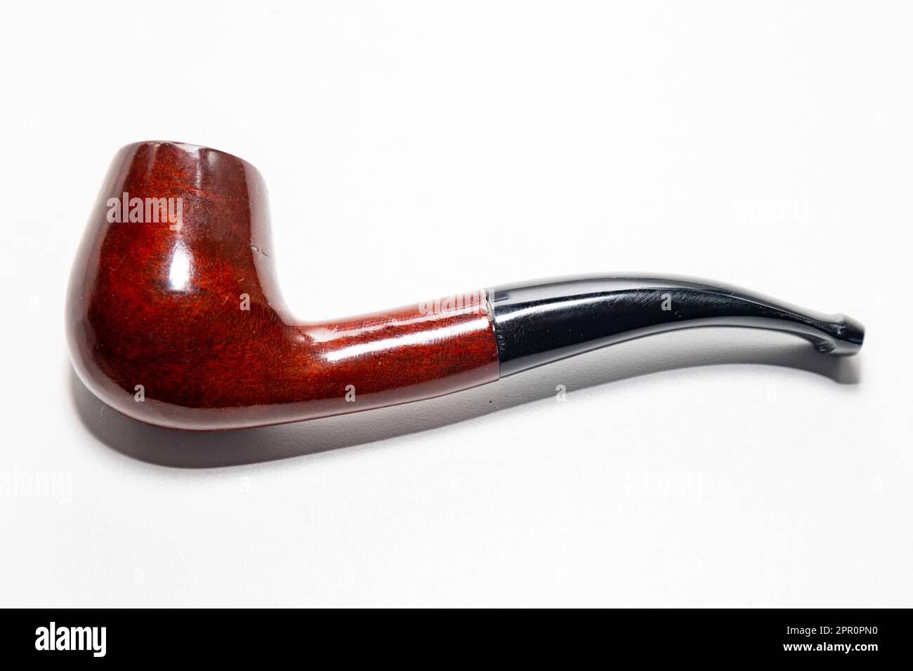 Traditional pipe isolated on light background Stock Photo - Alamy