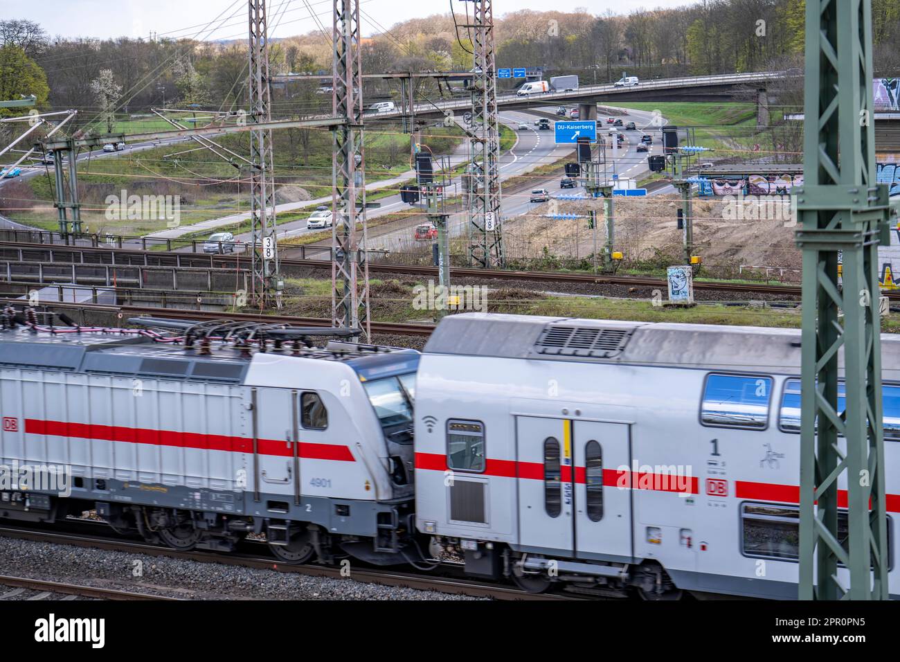 IC train on the railway line at the Kaiserberg motorway junction, the ...