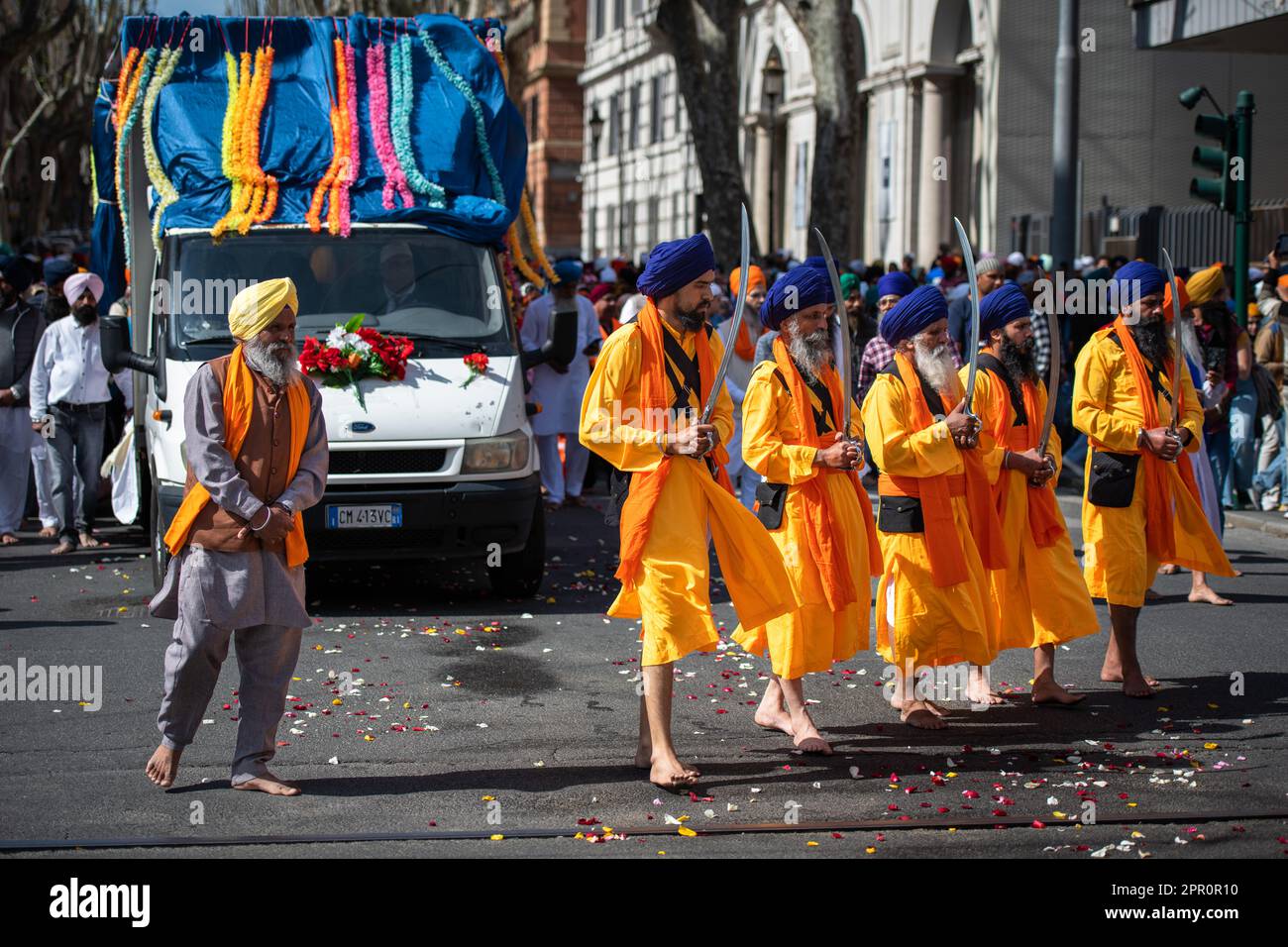 Sikh men with the kirpan, escort the Granth Sahib during the procession ...