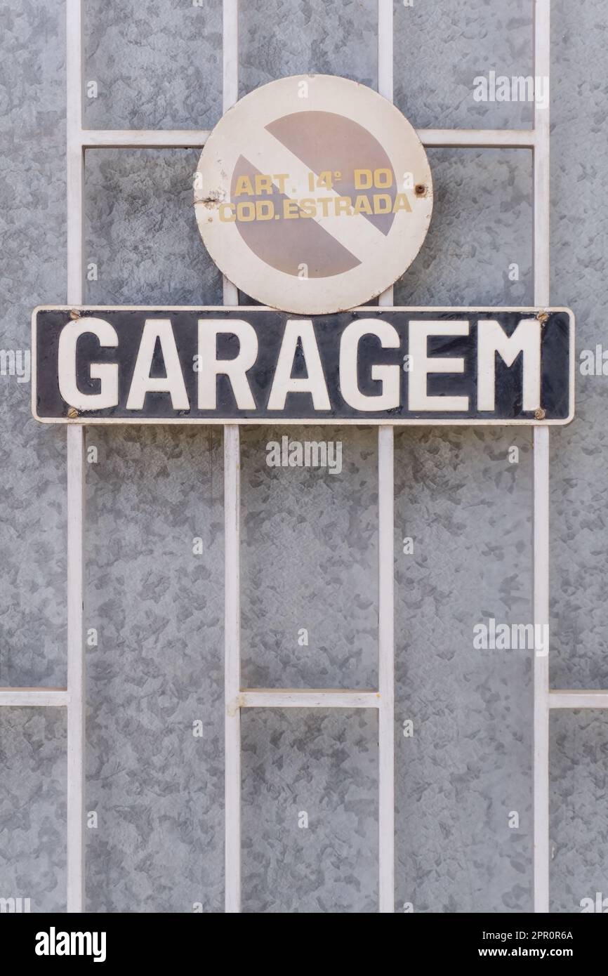 Retro sign garage on a metal grate background Stock Photo - Alamy