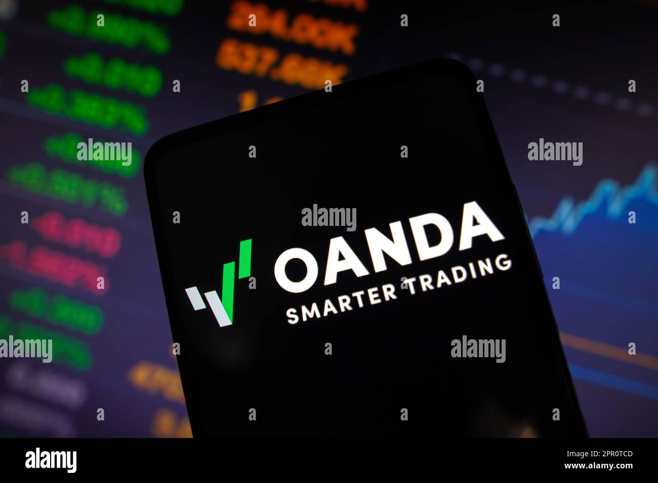 In this photo illustration, the Oanda Corporation logo is displayed on ...