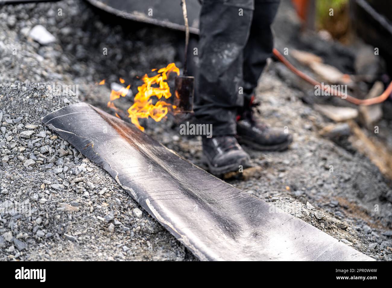 heating the asphalt with a flame. waterproofing of the foundation and ...