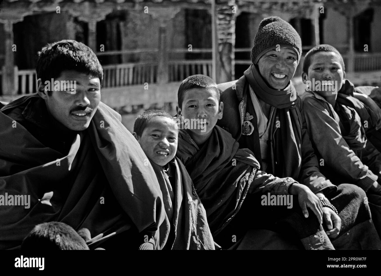 YOUNG MONKS sit in an upper courtyard of HEMIS GOMPA (monastery ...