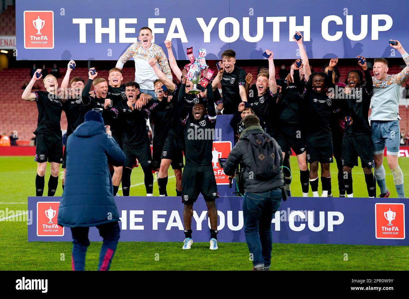 West Ham United's Gideon Kodua lifts the trophy after winning the FA ...