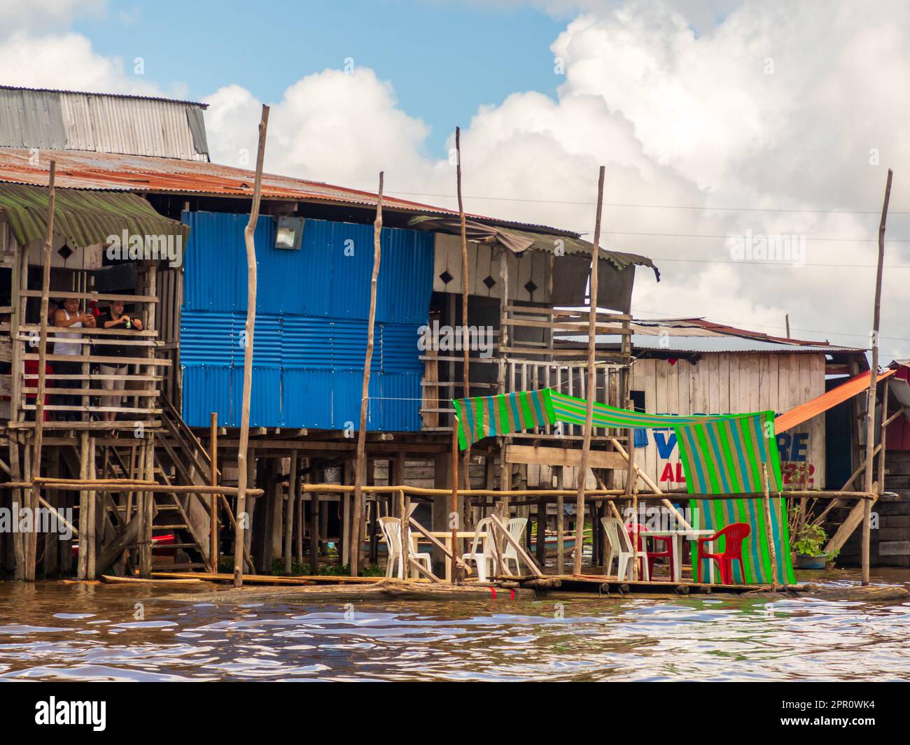 Iquitos, Peru - Apr, 2022: Floating shantytown of Belén, consisting of scores of huts, built on ...