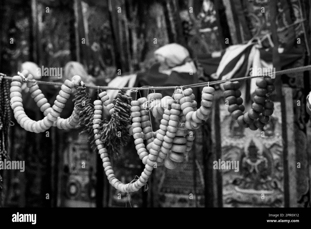 Strings of AMBER & CORAL are proffered for sale along the BARKHOR the ...