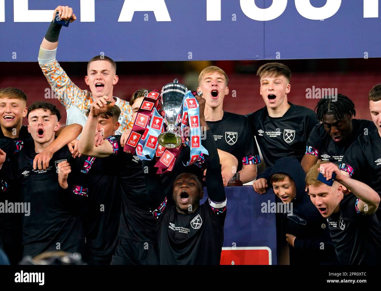 West Ham United's Gideon Kodua lifts the trophy after winning the FA ...