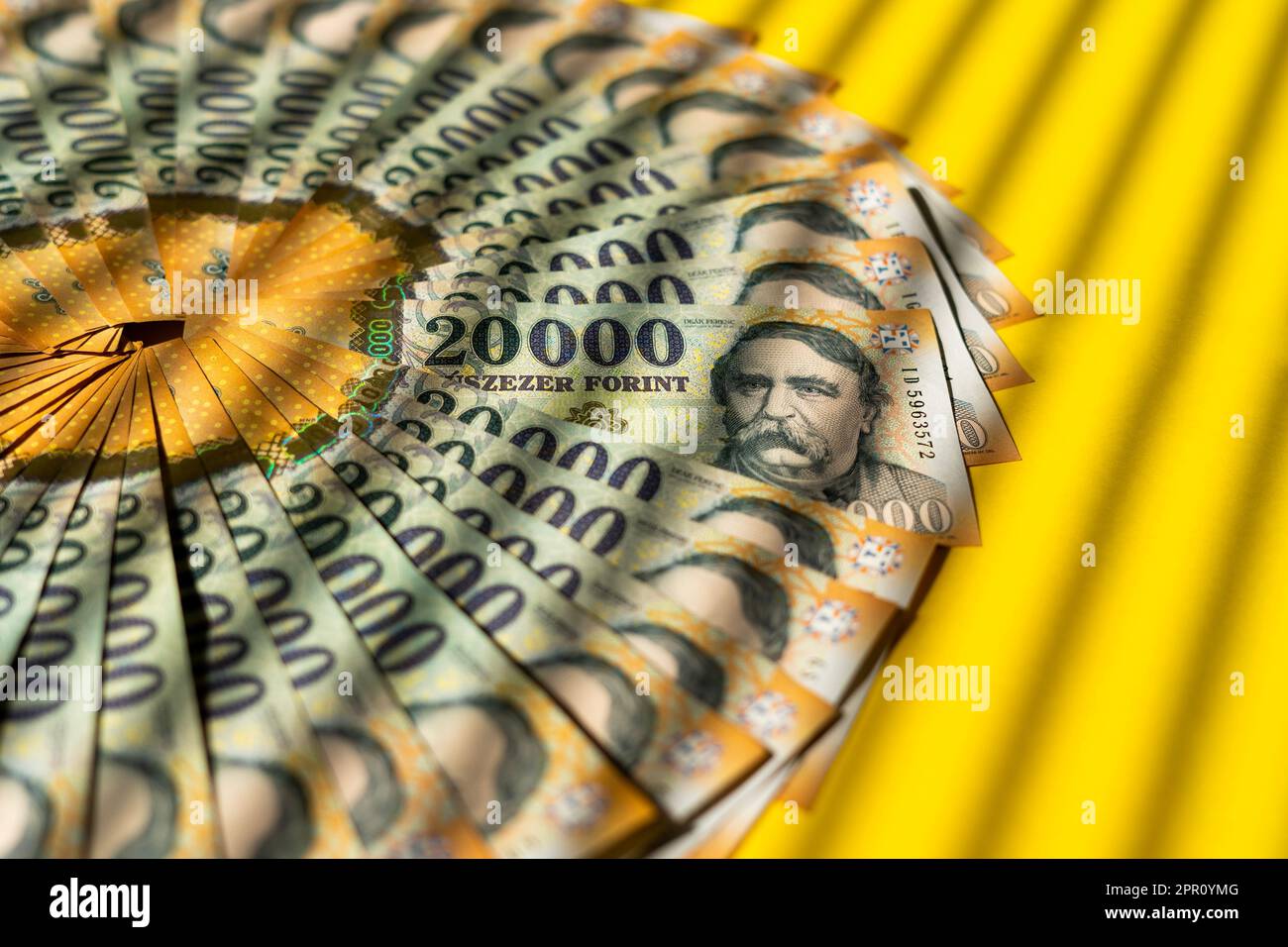 Hungarian HUF 20,000 banknotes with a yellow background arranged in a ...