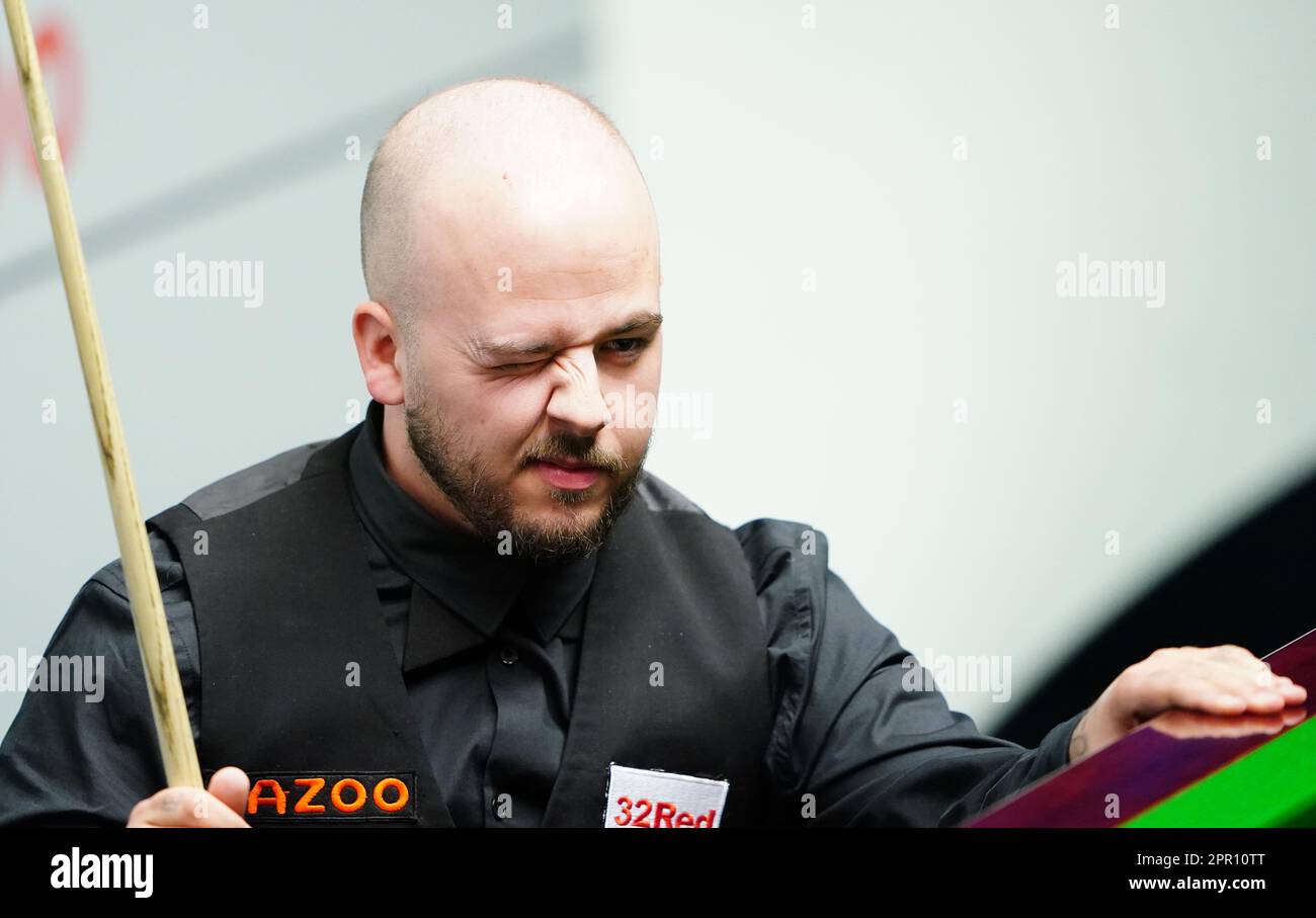 Luca Brecel in action against Ronnie O'Sullivan (not pictured) on day ...