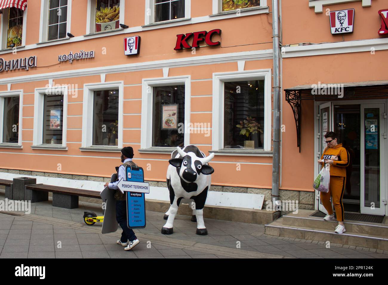 Moscow, Russia. 25th Apr, 2023. People walk past the KFC restaurant in ...