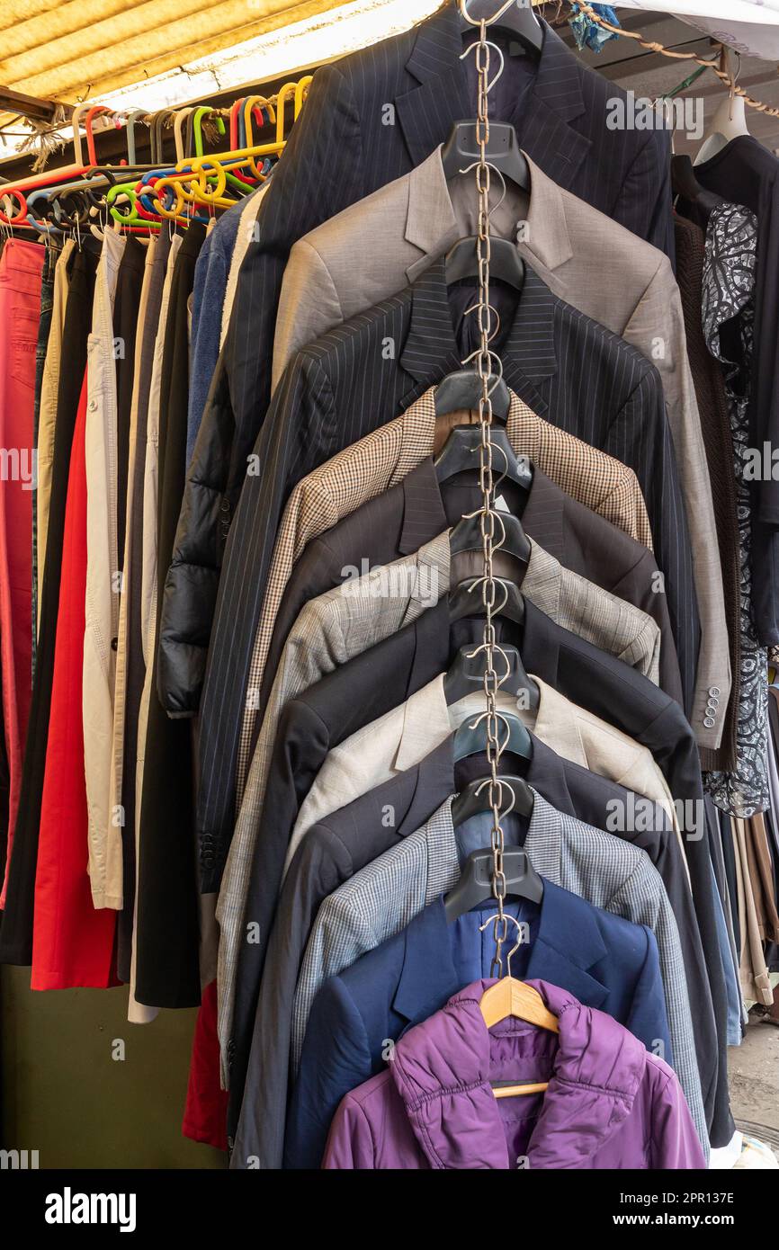 Modern second hand male jackets sold on market outside Stock Photo - Alamy