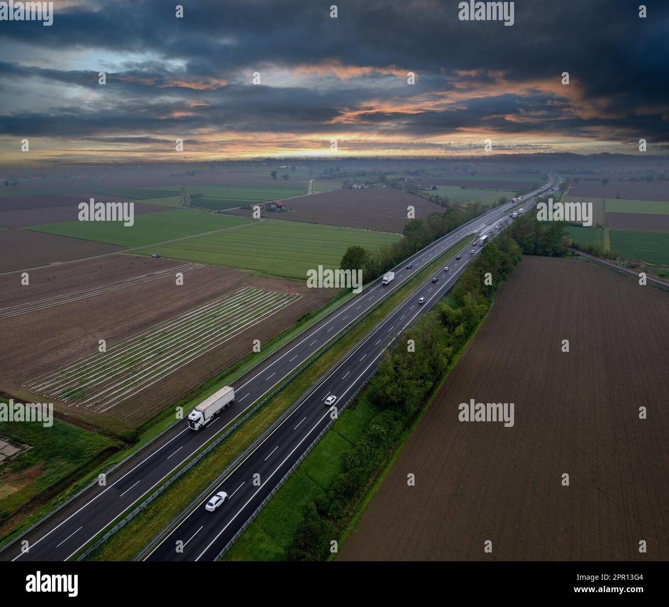 Cargo trucks and cars in the motorway a1 autostrada del sole aerial ...