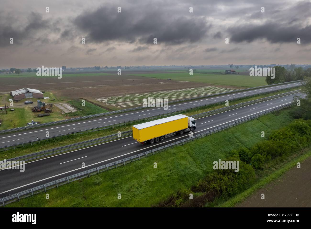 Cargo trucks and cars in the motorway a1 autostrada del sole aerial ...