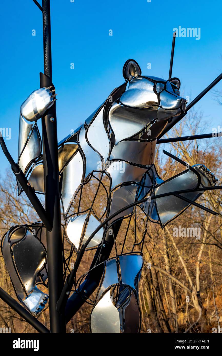 Bear sculpture by Ivan Iler, called "Black Bear Up a Tree," installed ...