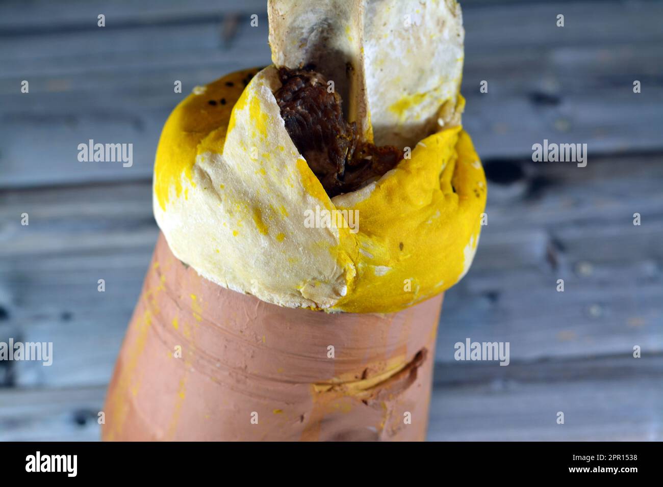 A pottery hot pot Jar covered with dough, sesame and lamb shank is ...