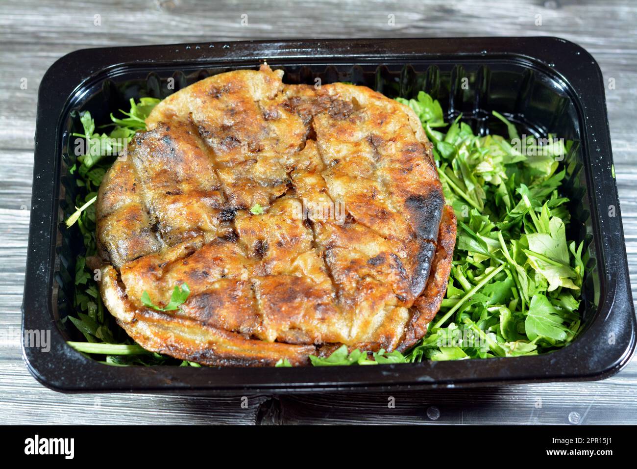 Traditional Egyptian dish Hawawshi, pita stuffed with minced meat and ...