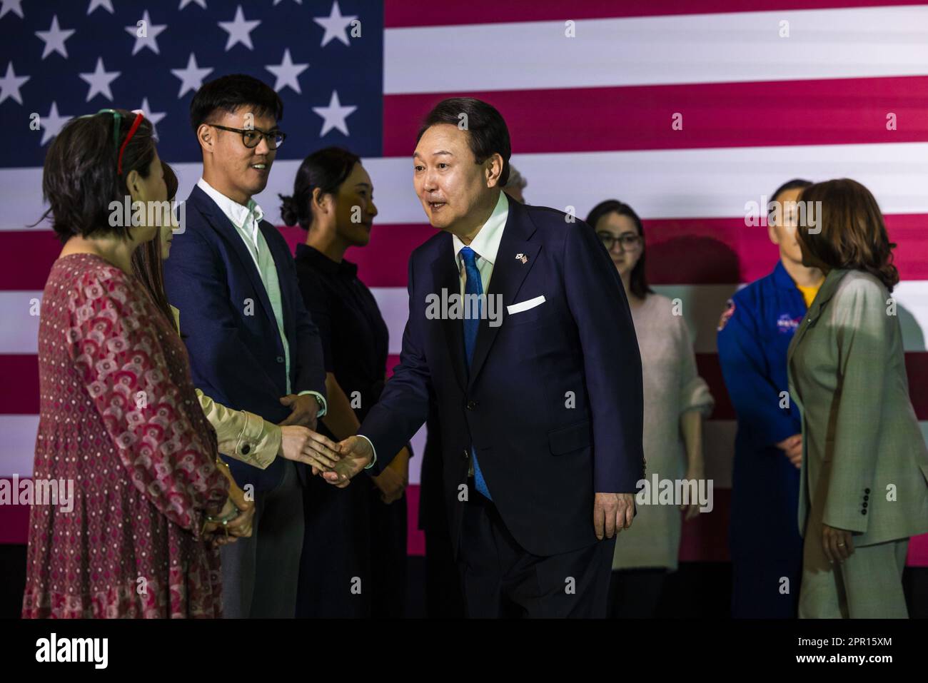 South Korean President Yoon Suk Yeol (R) greets Korean-American ...