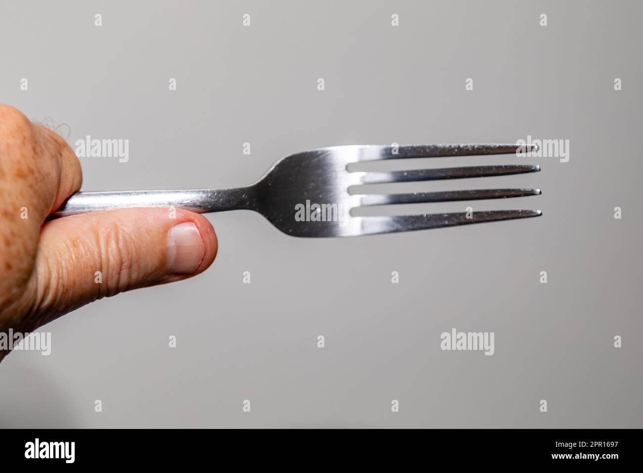 Hand human fork cutlery hi-res stock photography and images - Alamy