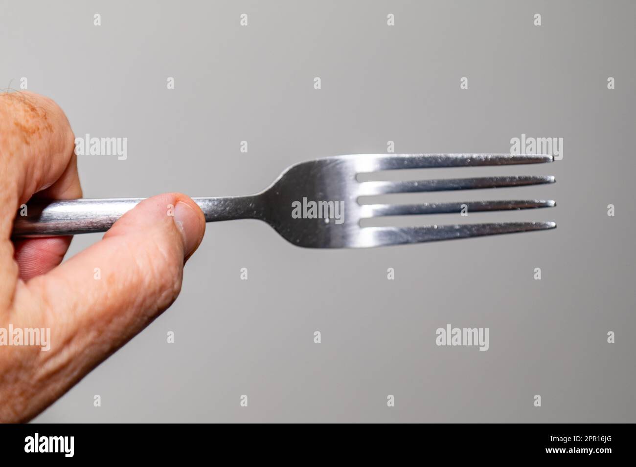 Hand human fork cutlery hi-res stock photography and images - Alamy