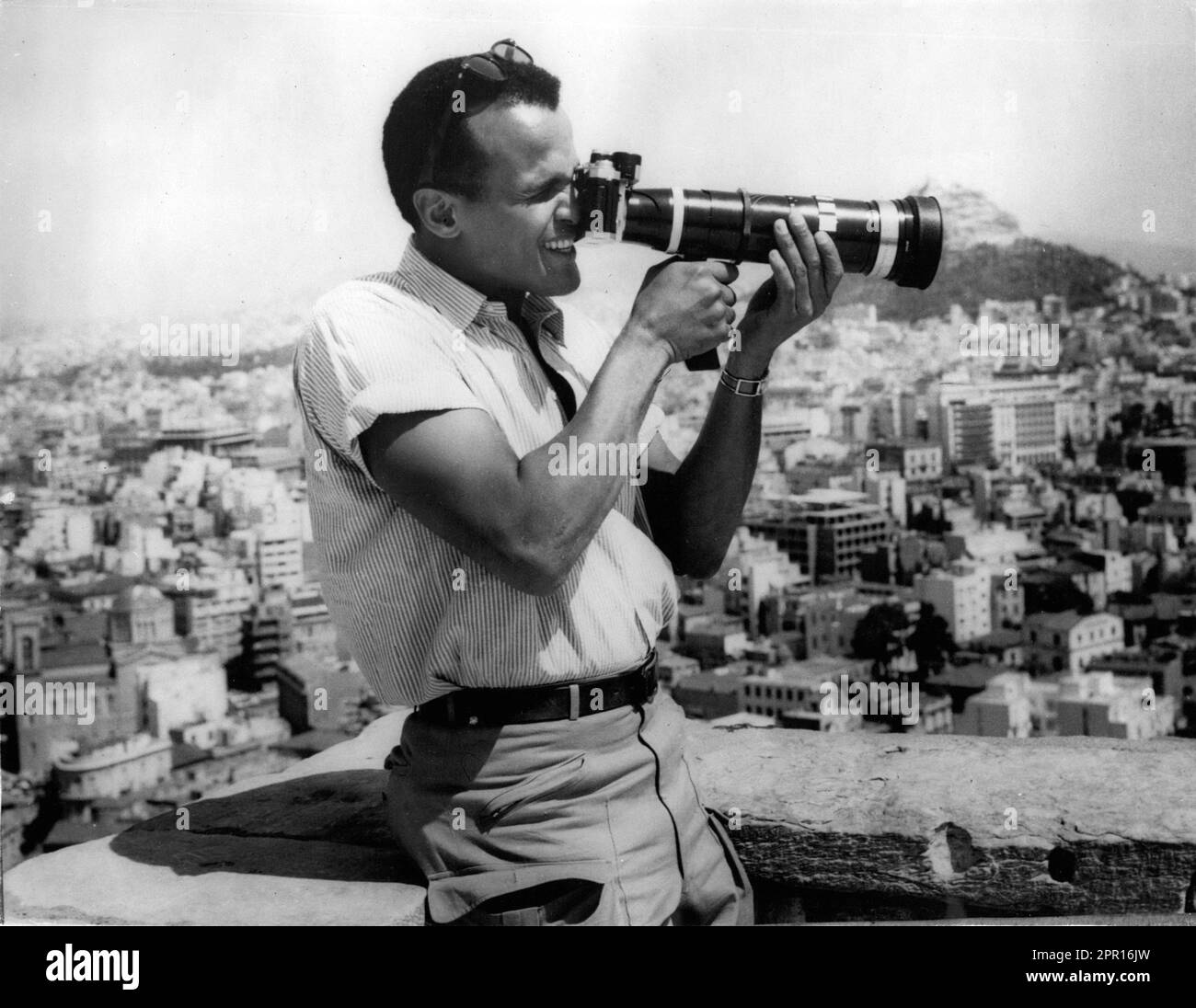 September 9, 1960, Athens, Greece: Actor HARRY BELAFONTE peers through ...