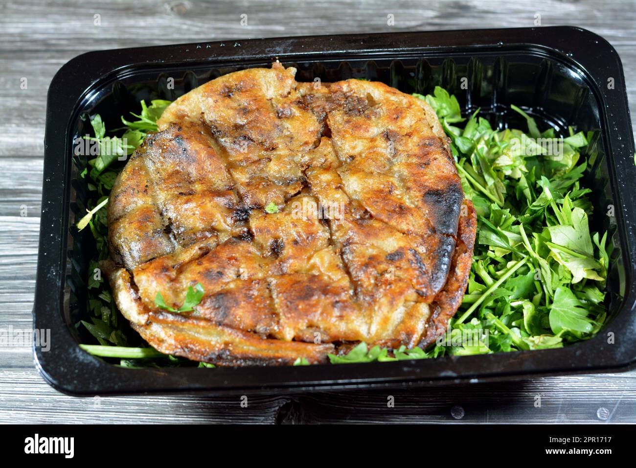 Traditional Egyptian dish Hawawshi, pita stuffed with minced meat and ...
